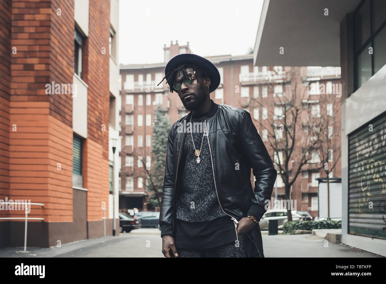 portrait of young black man in urban background – calm, youth, natural ...