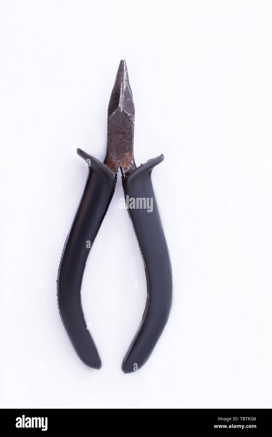 Old rusty pliers, top view. Pliers with black handle isolated on white ...