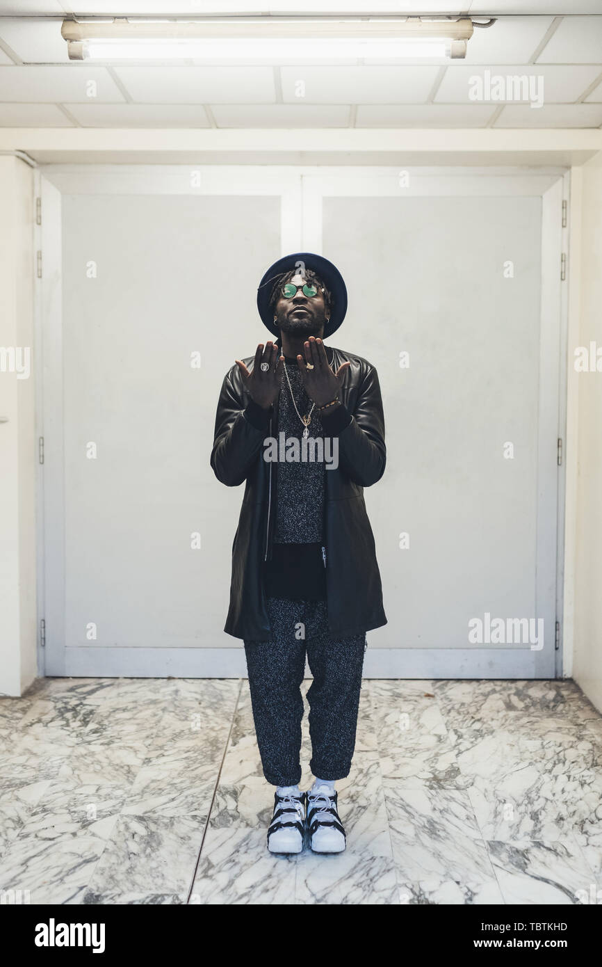 portrait of young african man standing with open hands– self confidence ...