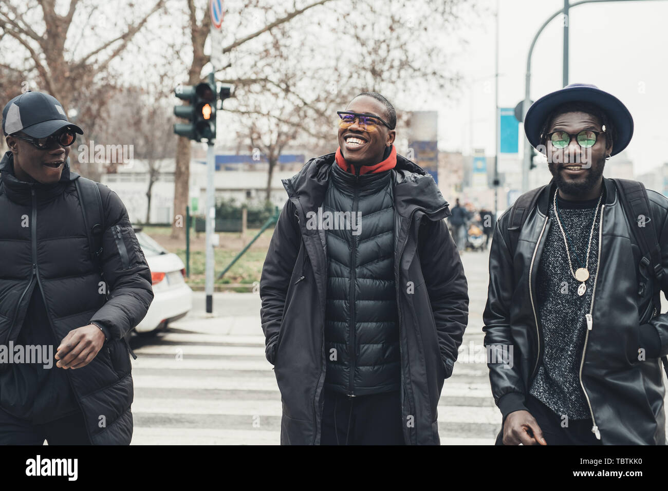 Three young african men crossing the street together – relationship ...