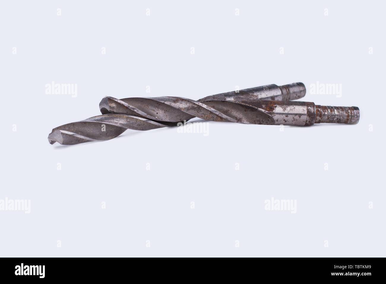 Rusty drill bits on white background. Old spiral tool for perforator ...