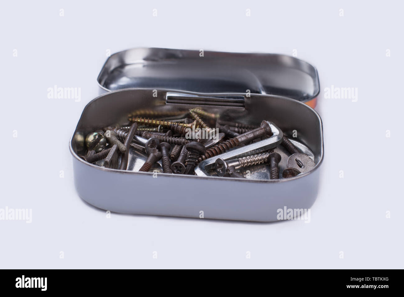Screws in metal box on white background. Tools in metal organizer ...