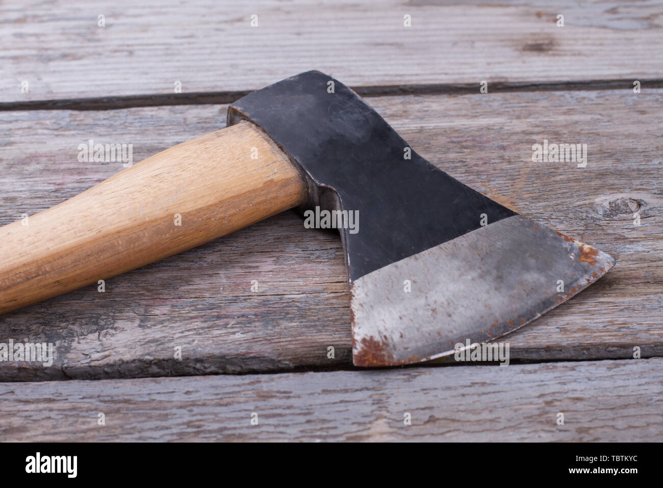 Old axe on vintage wooden background. Tool on wooden boards. Vintage ...