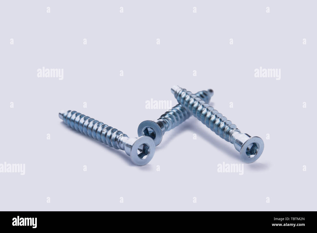 Hardware screws nails for construction on a white background. Three ...
