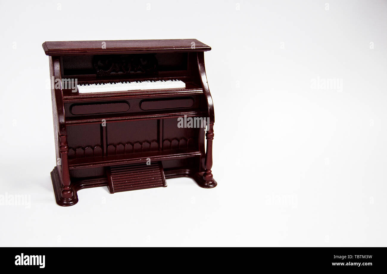 miniature classical piano keyboard instrument isolated on white ...
