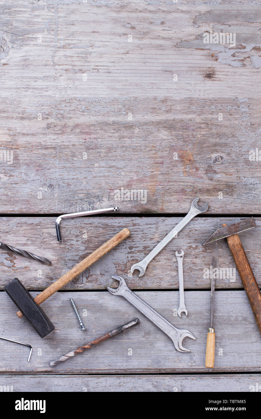 Construction tools on wooden boards. Hammer, spanners and other ...