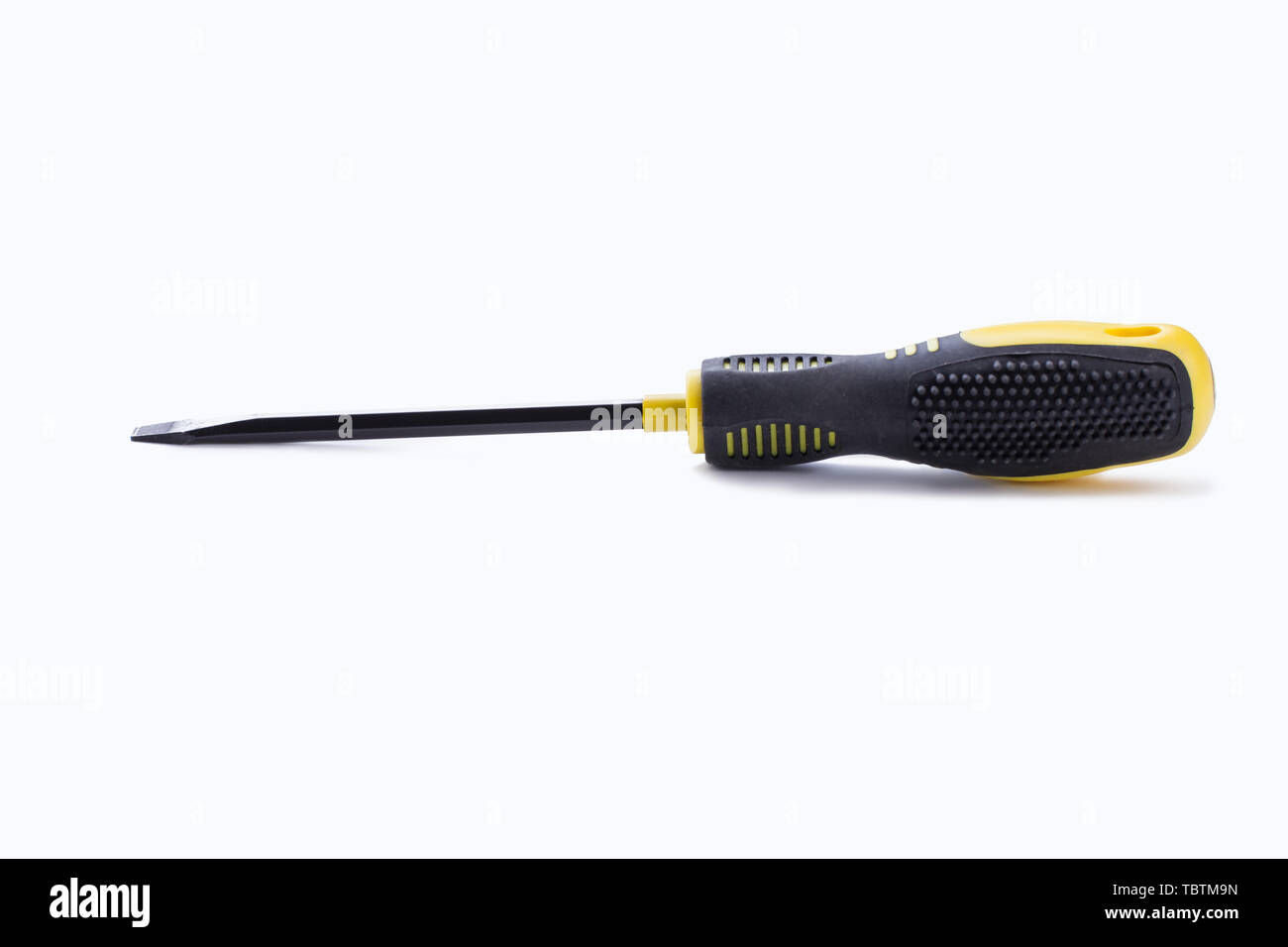 Screwdriver with black and yellow handle. Flathead screwdriver with ...