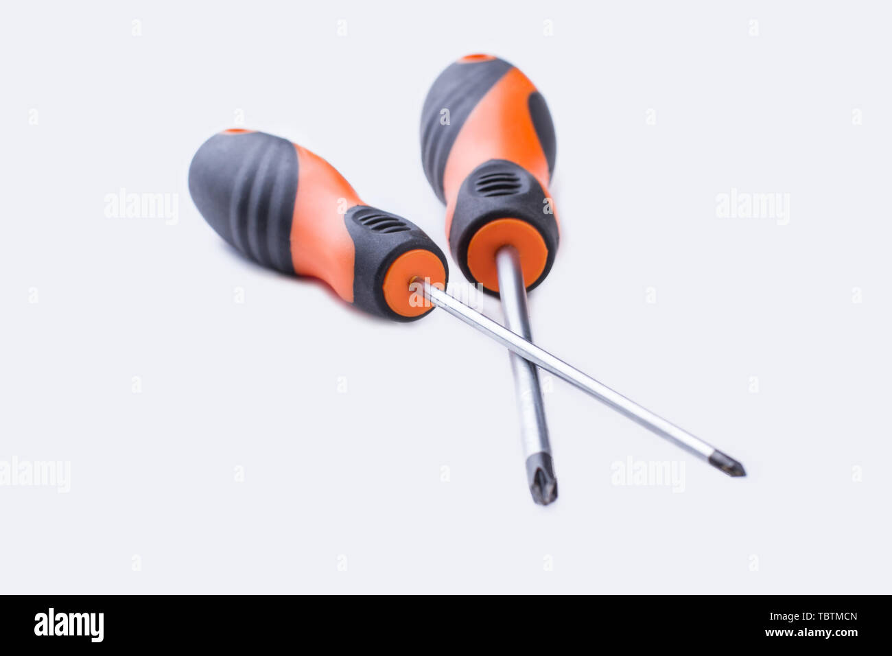Two crossed screwdrivers isolated on white background. Repair tools ...