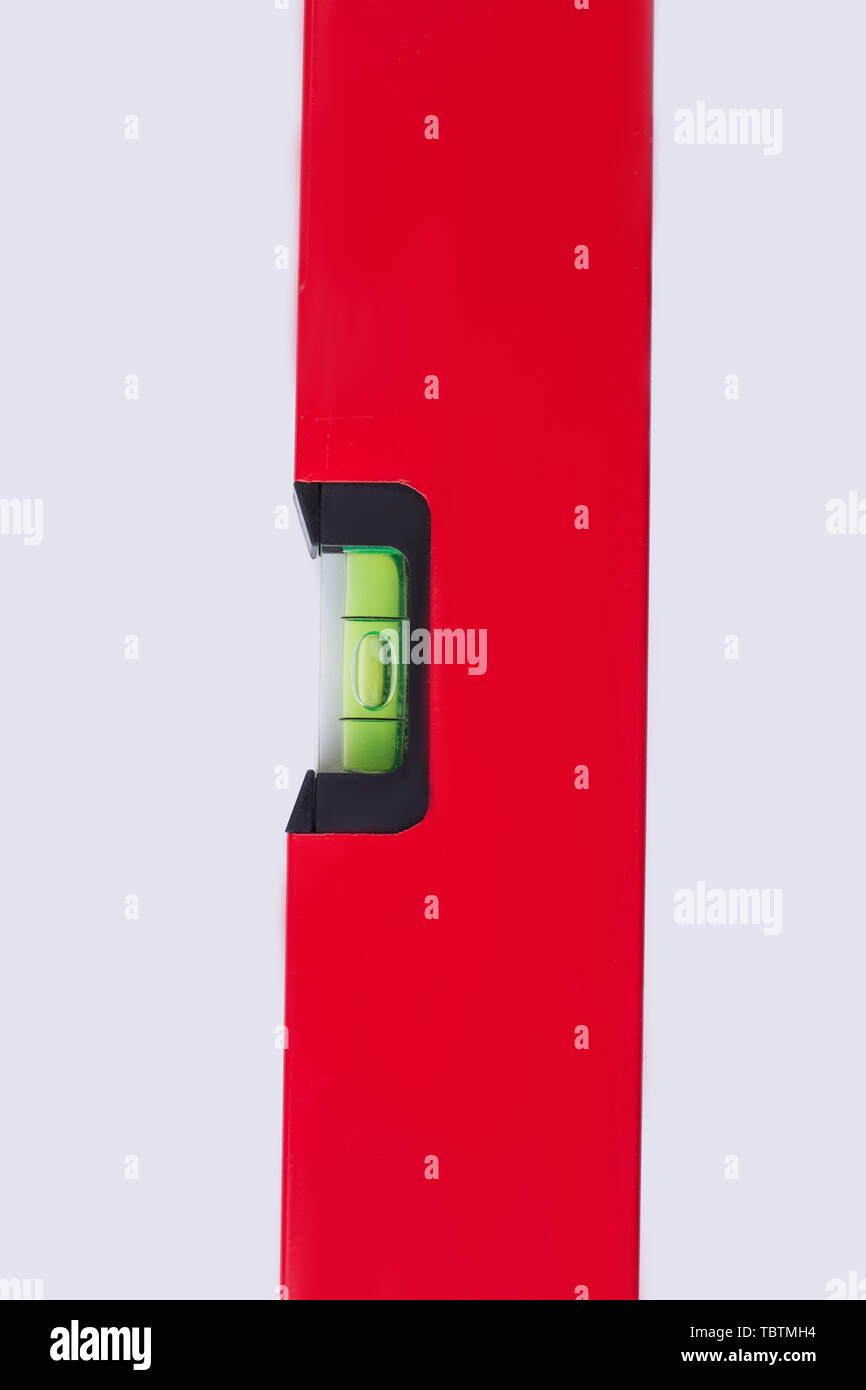 Close up of spirit level on white background. Building tool, vertical ...