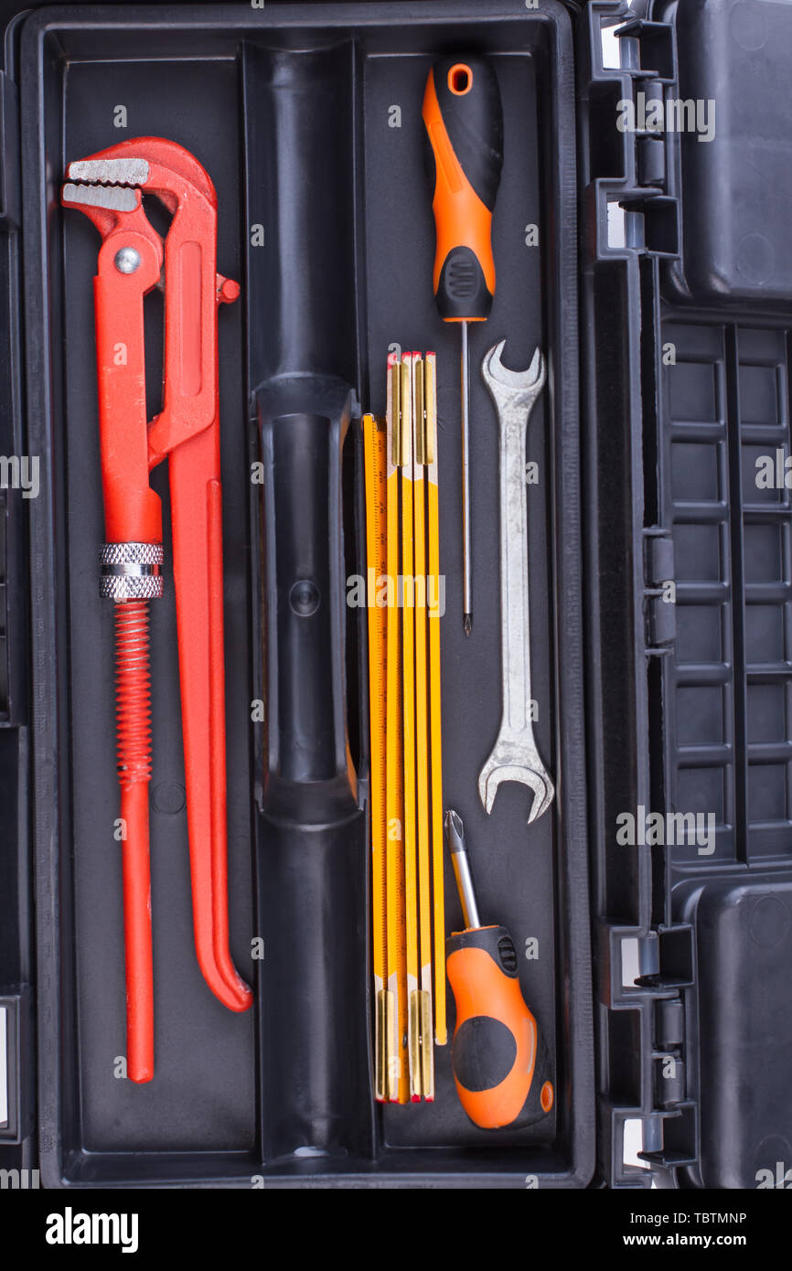 Blac box with different tools, top view. Instrument toolbox with tools ...