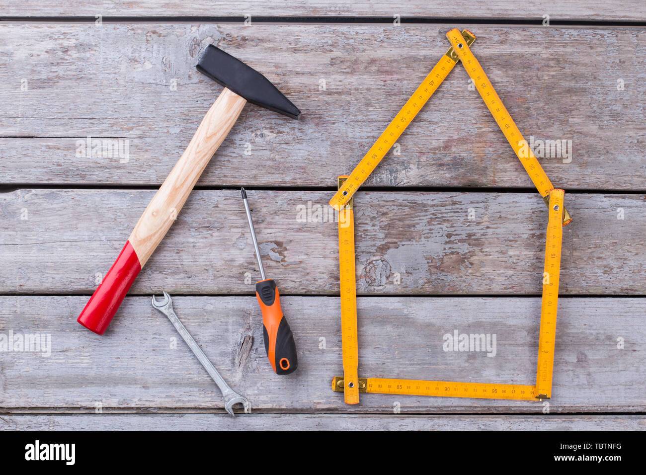 Construction tools on vintage wooden background. Hammer, screwdriver ...