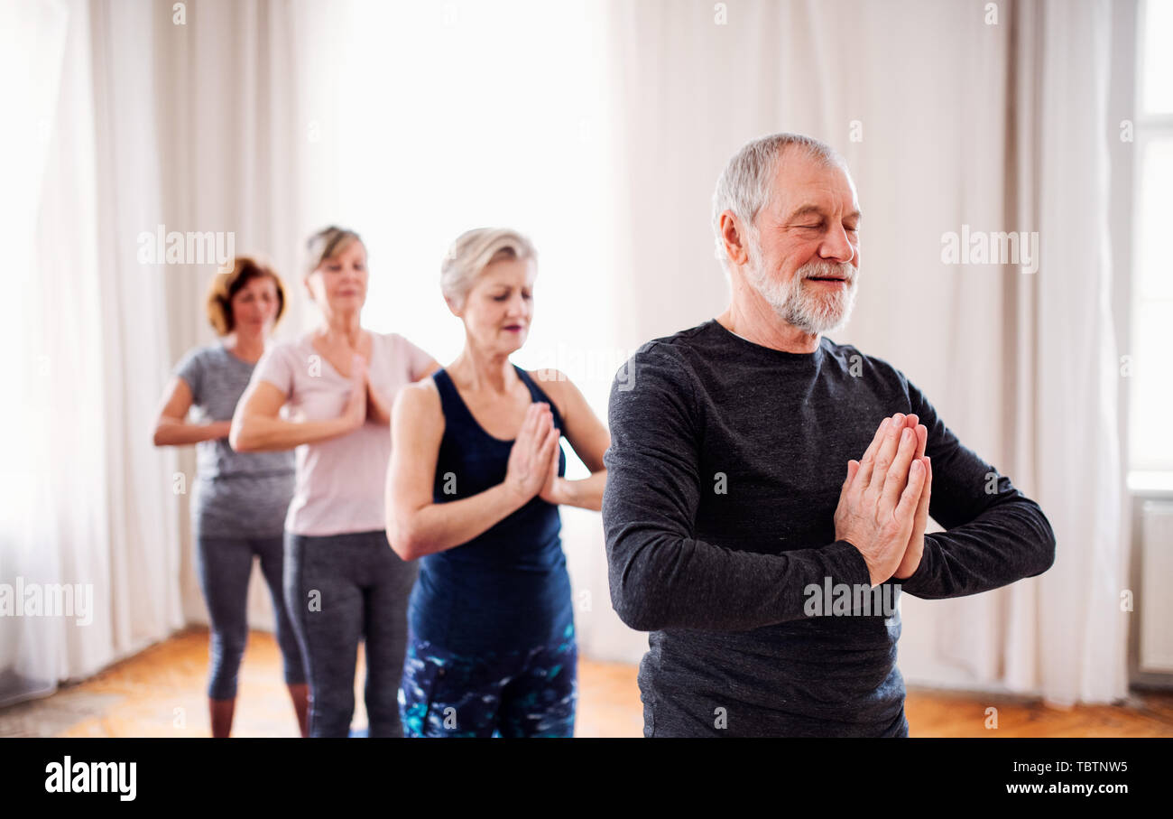 Group of senior people doing exercise in community center club Stock ...