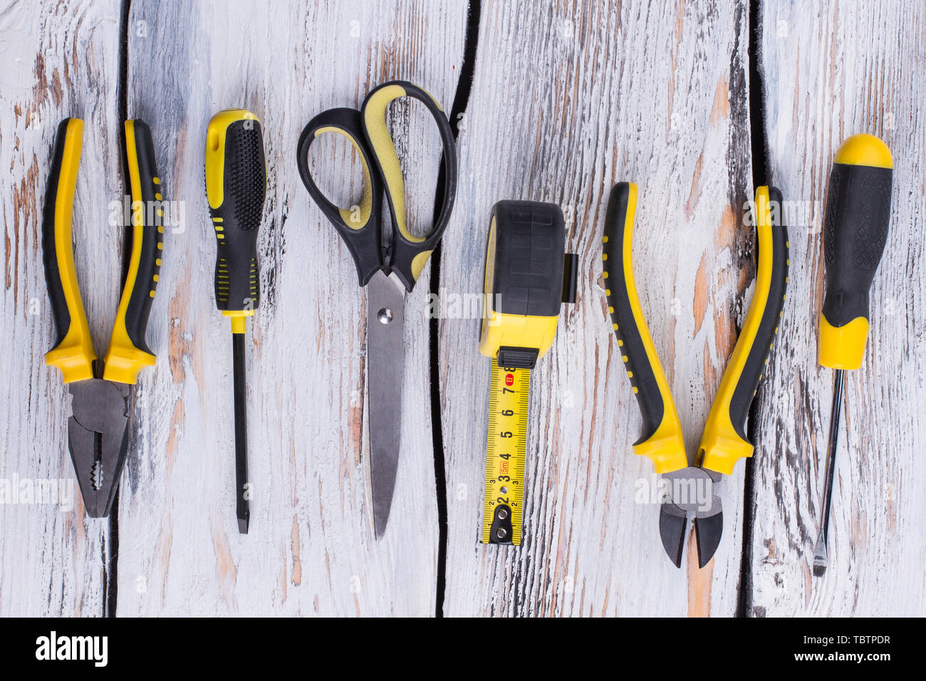Work tools on wooden background. Supplies for house repair ...