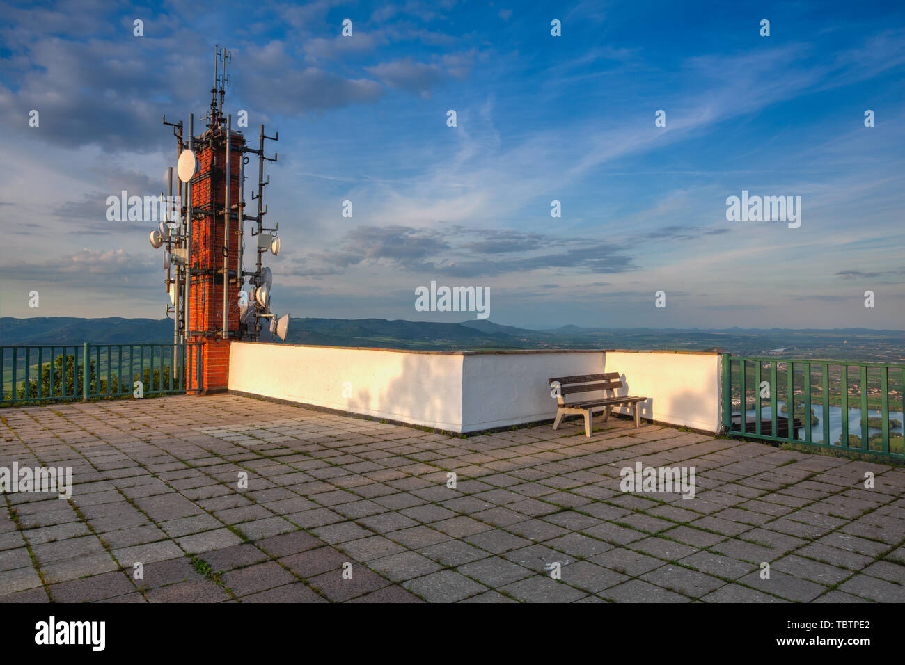 Telecommunication tower antenna on the hill at sunset. Digital wireless ...