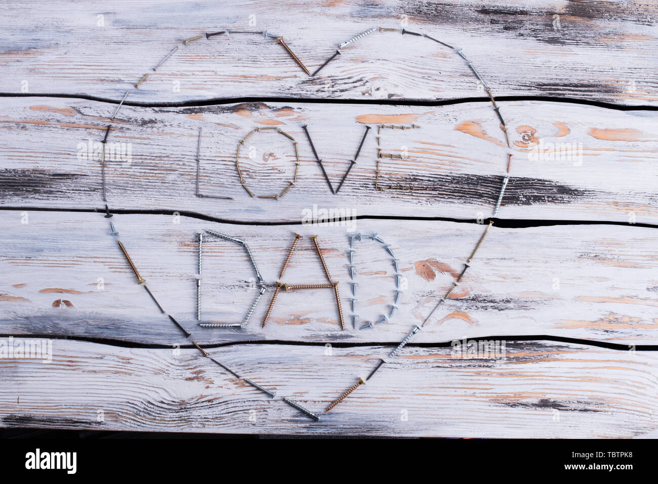 LOVE DAD text and heart made from screws. Composition for Fathers Day ...