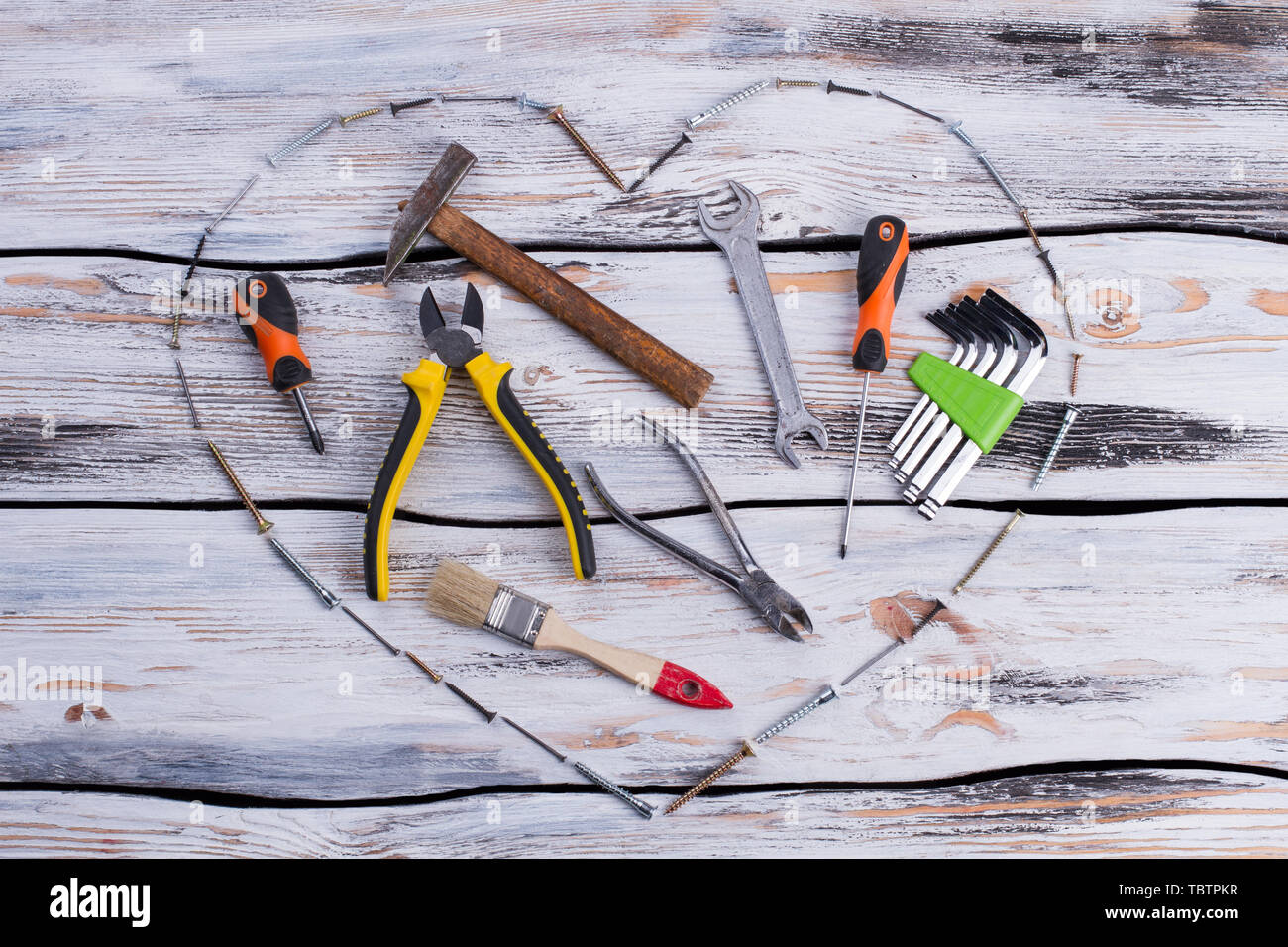 Various construction tools on wooden background. Heart shape made from ...