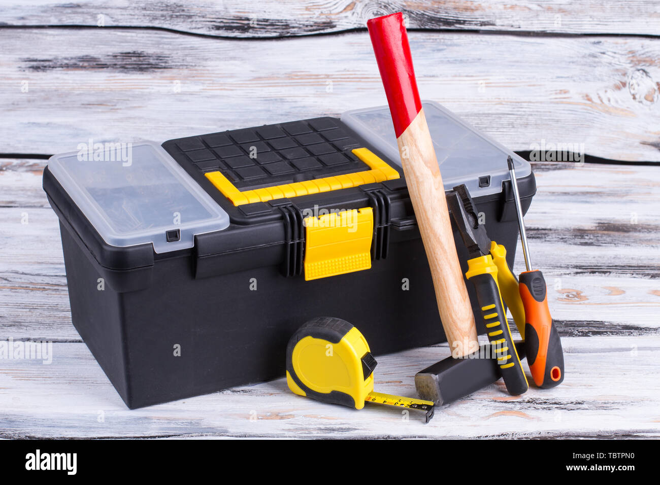 Tool box and different tools on wooden background. Builder ruler ...
