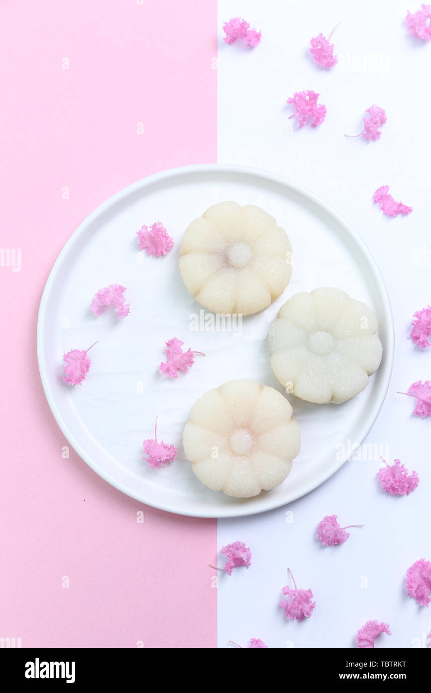 Ice moon cakes on pink background Stock Photo - Alamy