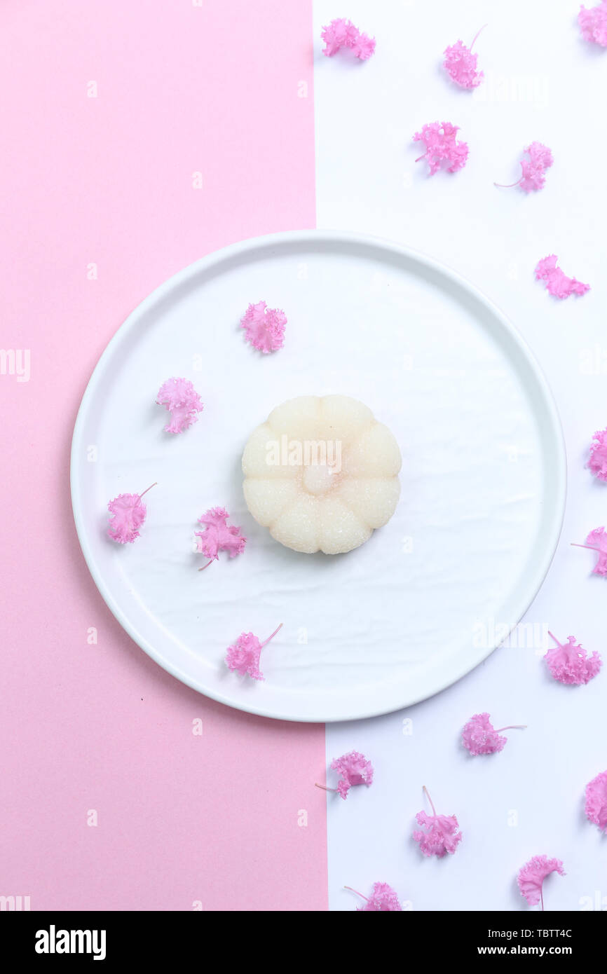 Ice moon cakes on pink background Stock Photo - Alamy