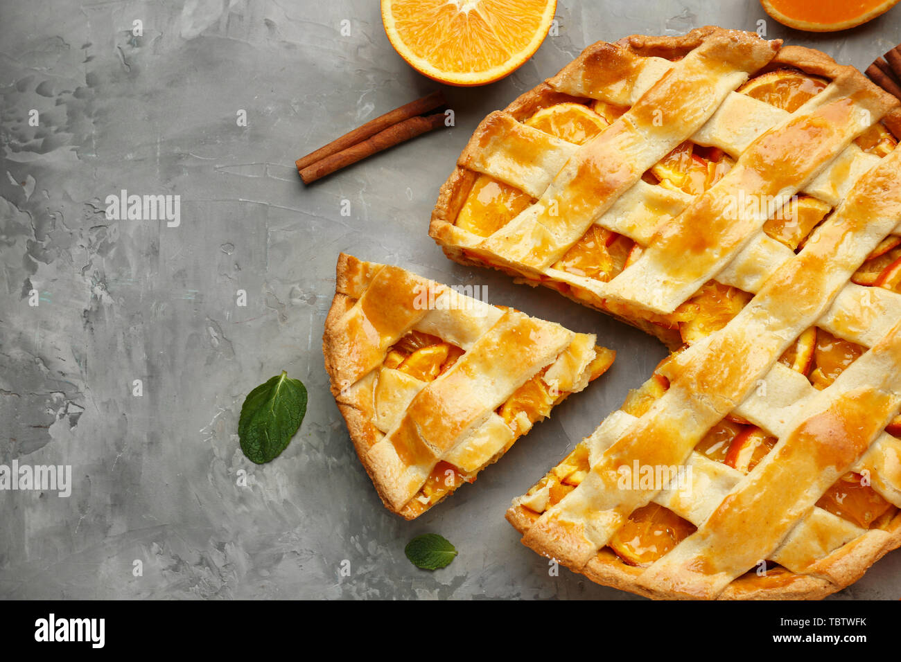 Tasty orange pie on grey background Stock Photo - Alamy