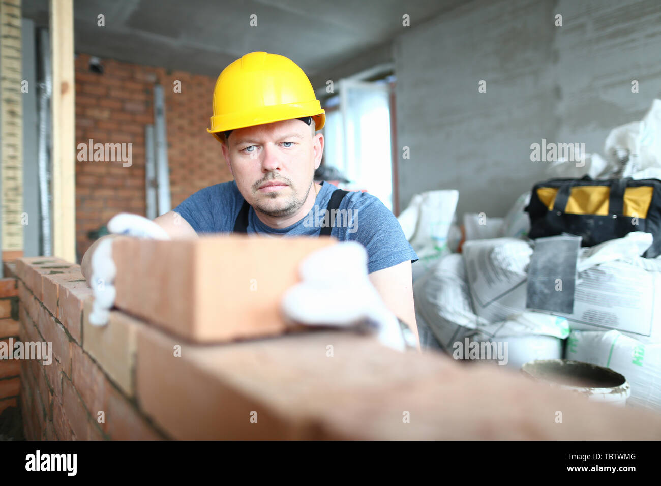 Craftsman man laying blocks hi-res stock photography and images - Alamy