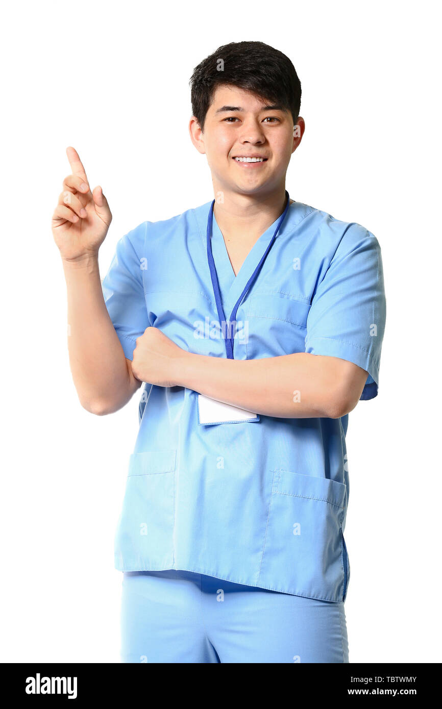 Male medical assistant with raised index finger on white background ...