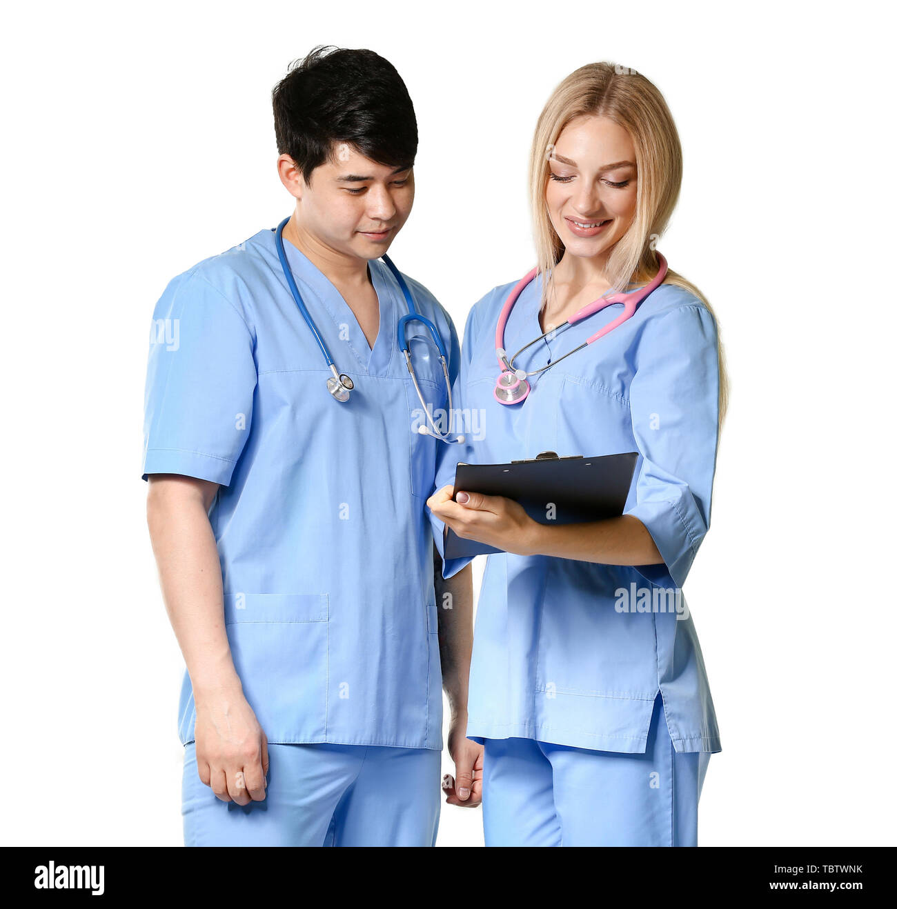 Medical assistants discussing diagnosis on white background Stock Photo ...