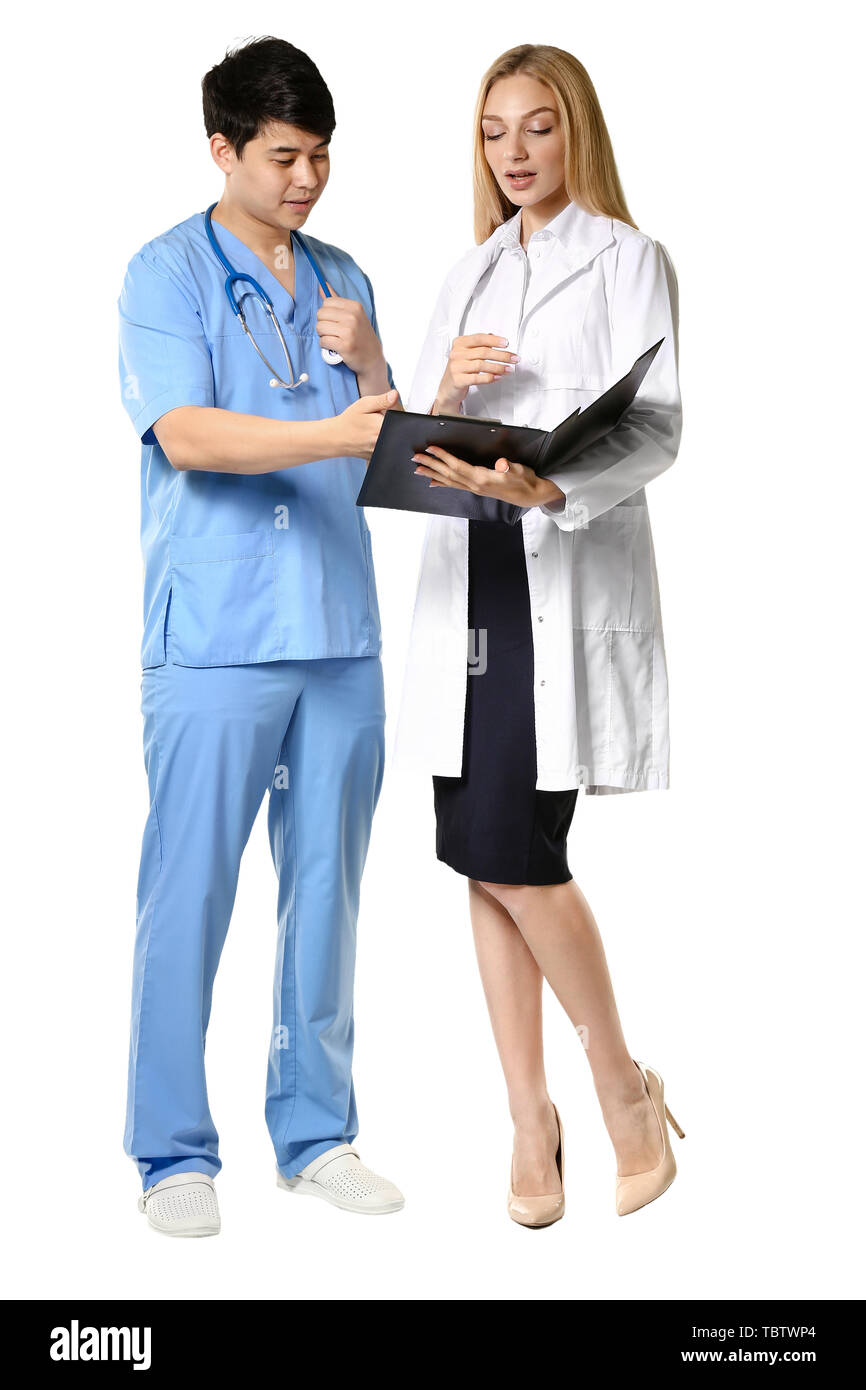 Female doctor and male medical assistant on white background Stock ...