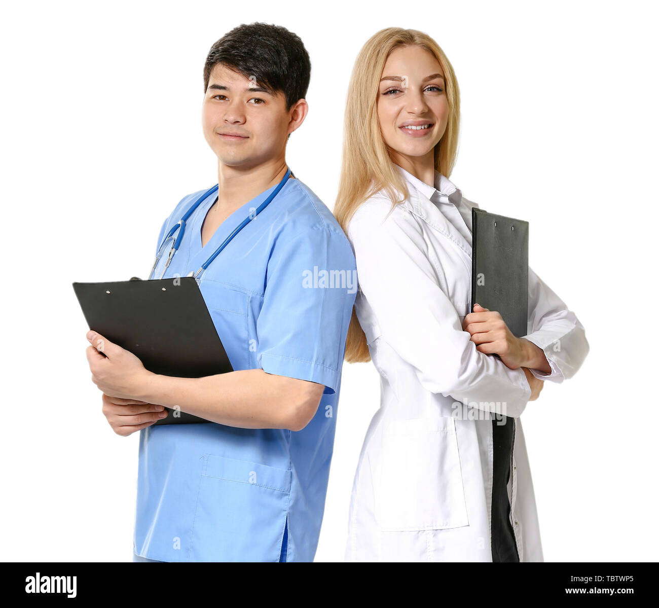 Female doctor and male medical assistant on white background Stock ...