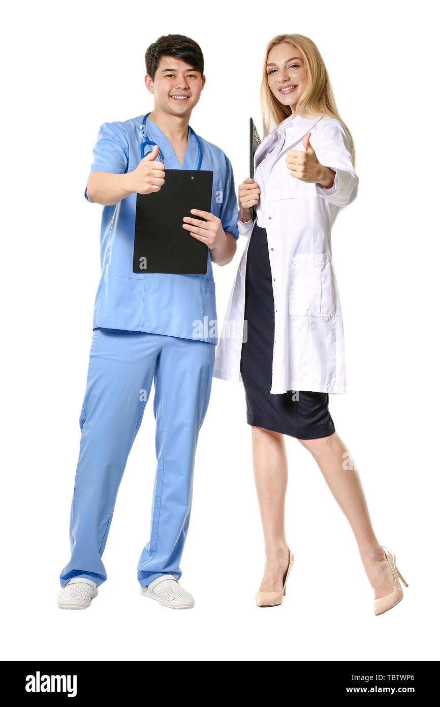 Female doctor and male medical assistant on white background Stock ...
