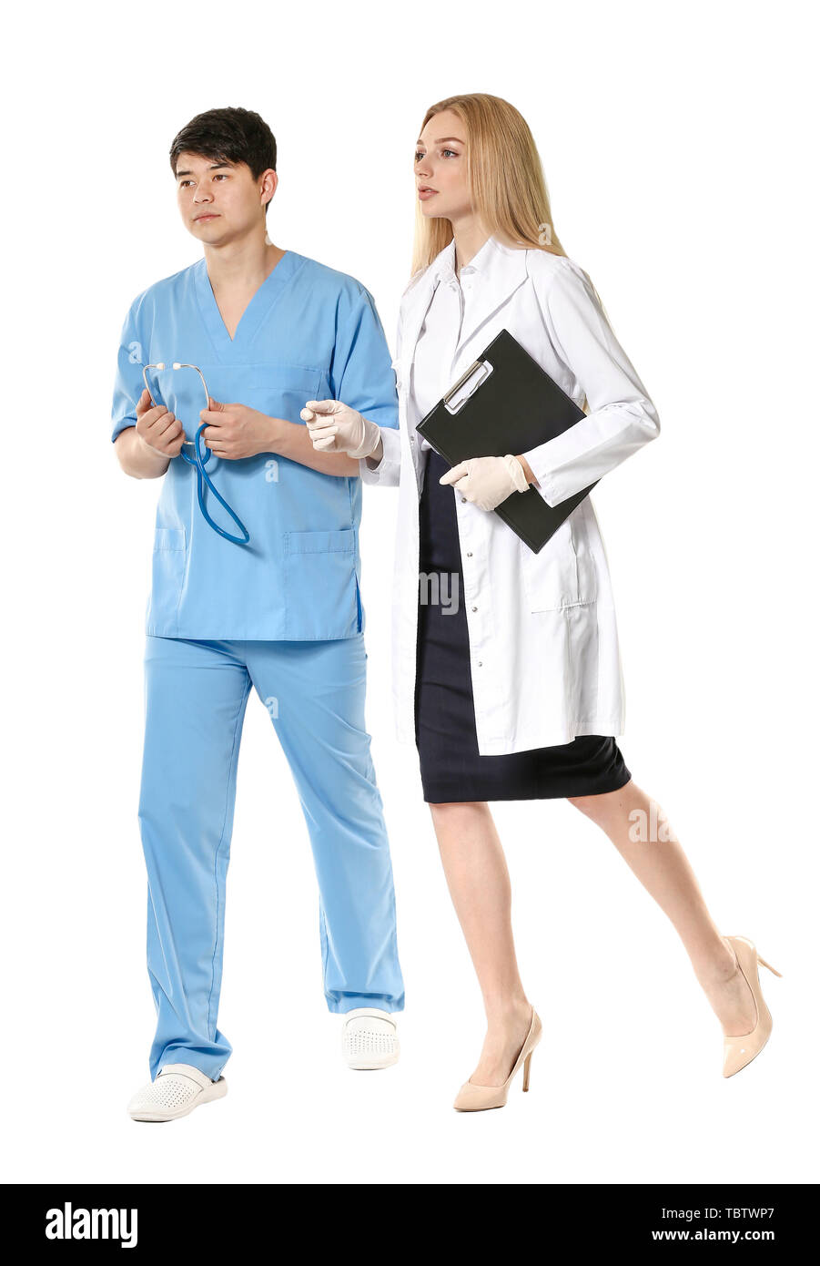 Female doctor and male medical assistant on white background Stock ...