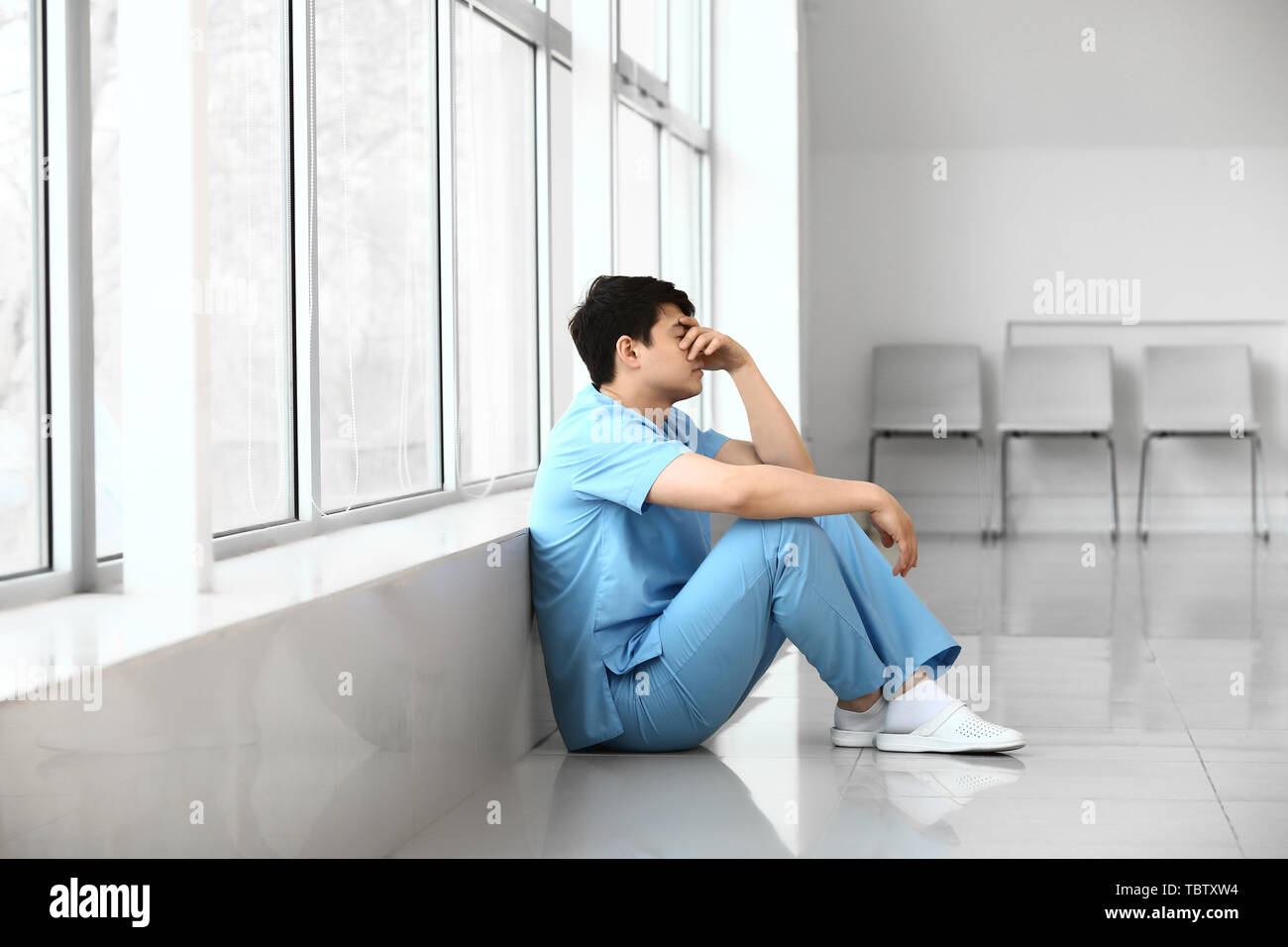 Stressed male medical intern hi-res stock photography and images - Alamy