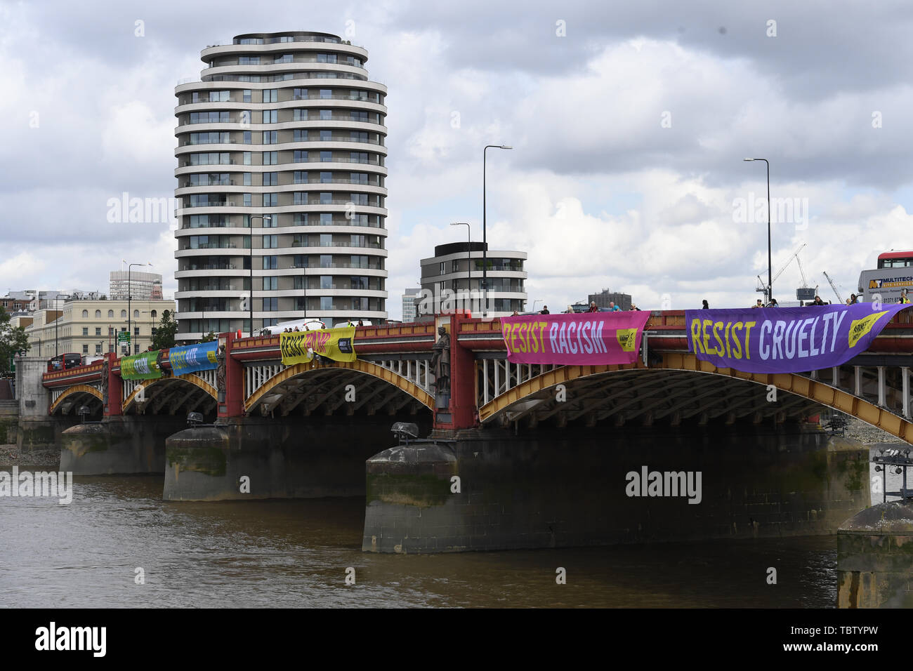 Activist from Amnesty International unfurl anti-Trump banners from ...