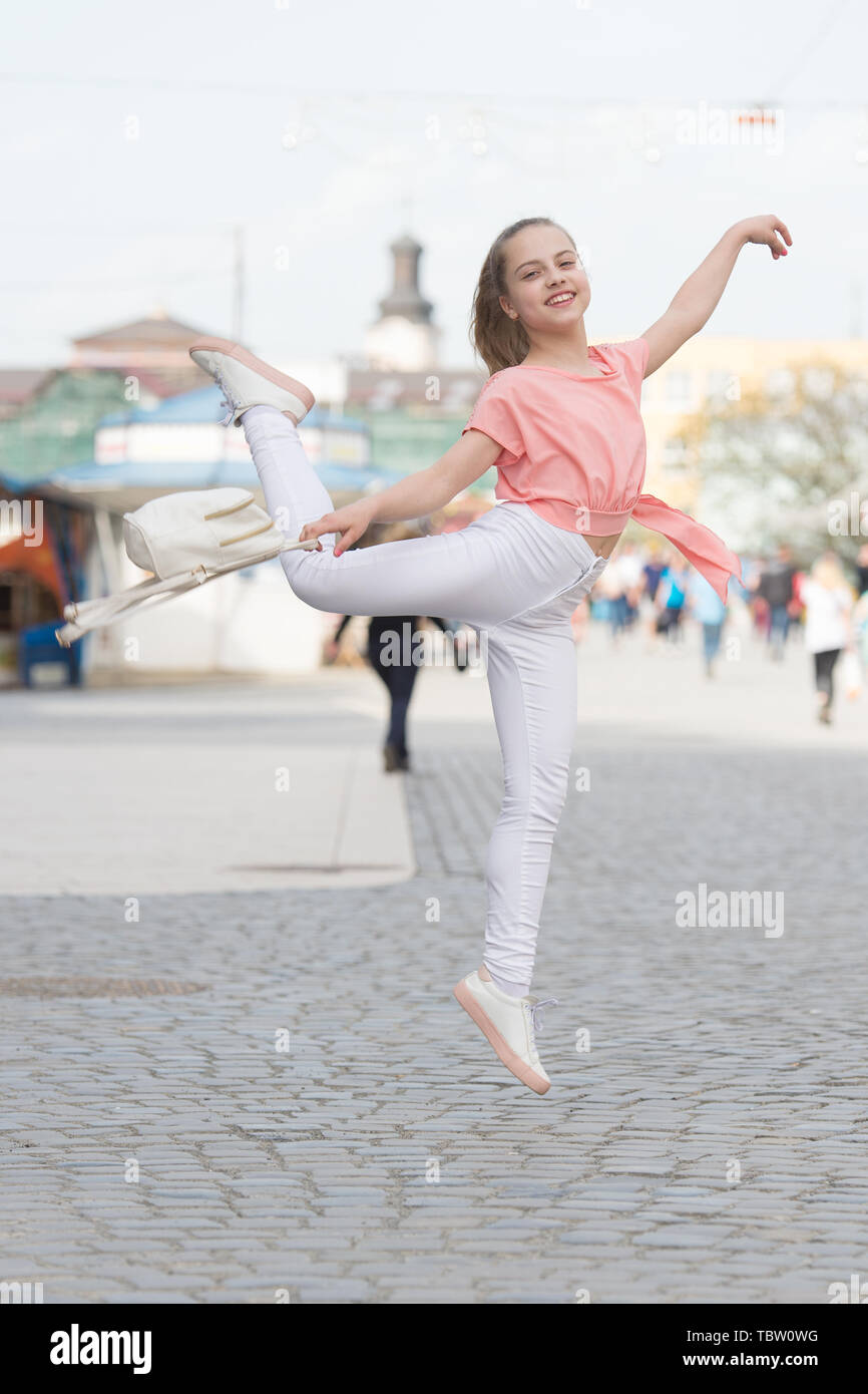 The dancer is at her best. Adorable street dancer. Little female dancer ...