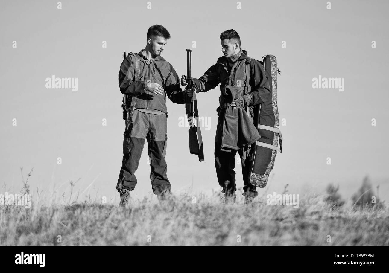 Be careful. Hunters gamekeepers walk mountains background. Hunters with ...