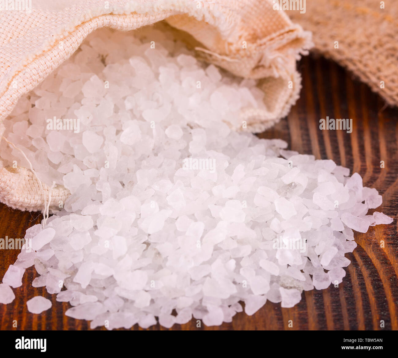 sea salt in jute sack on wooden table Stock Photo - Alamy