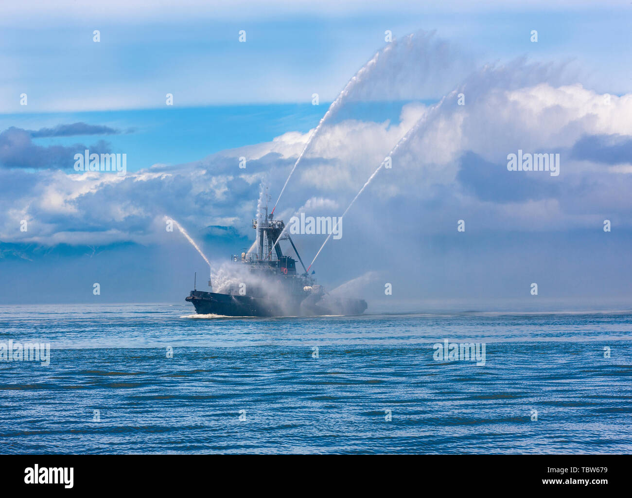 Ship spraying water cannon hi-res stock photography and images - Alamy