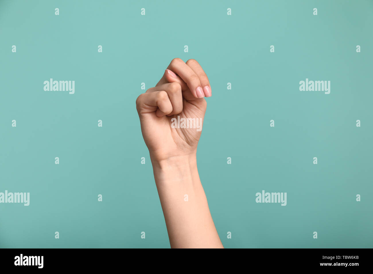 Female hand showing letter N on color background Stock Photo - Alamy