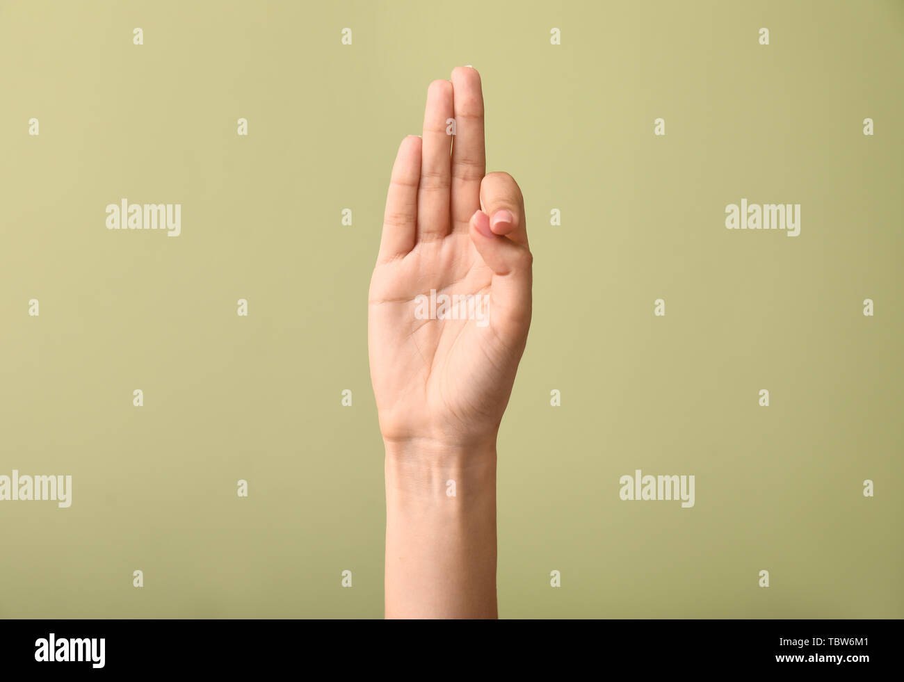 Female hand showing letter F on color background Stock Photo - Alamy