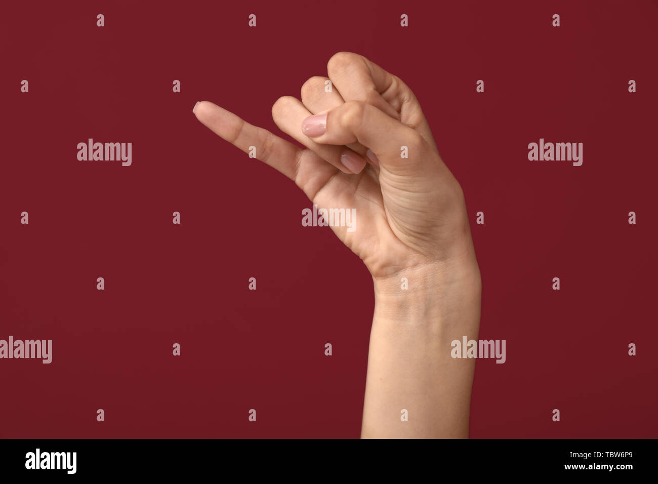 Female hand showing letter J on color background Stock Photo - Alamy