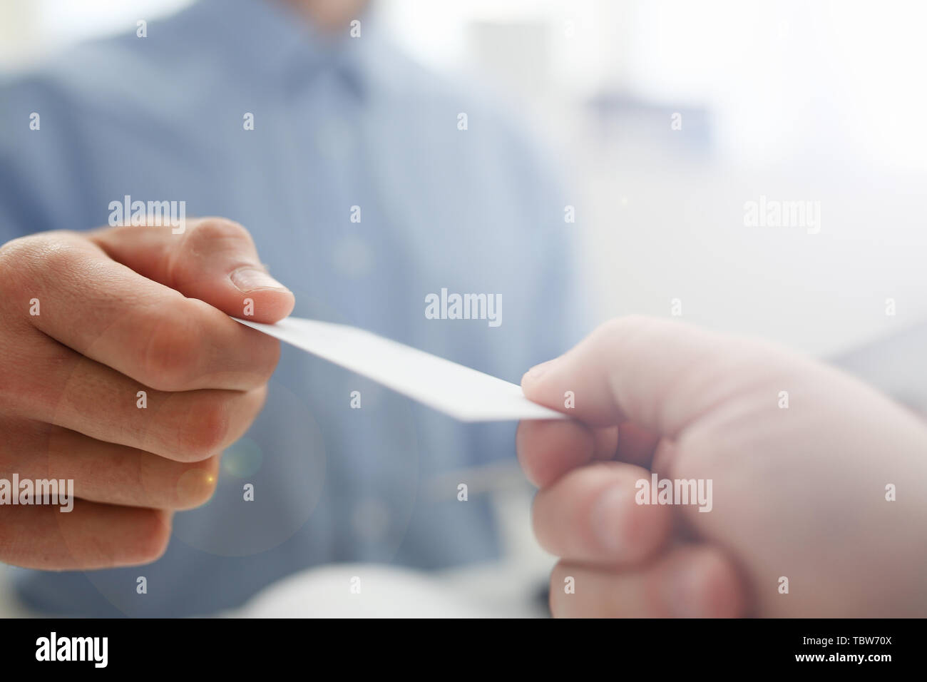 Male hand in suit give blank calling card Stock Photo - Alamy