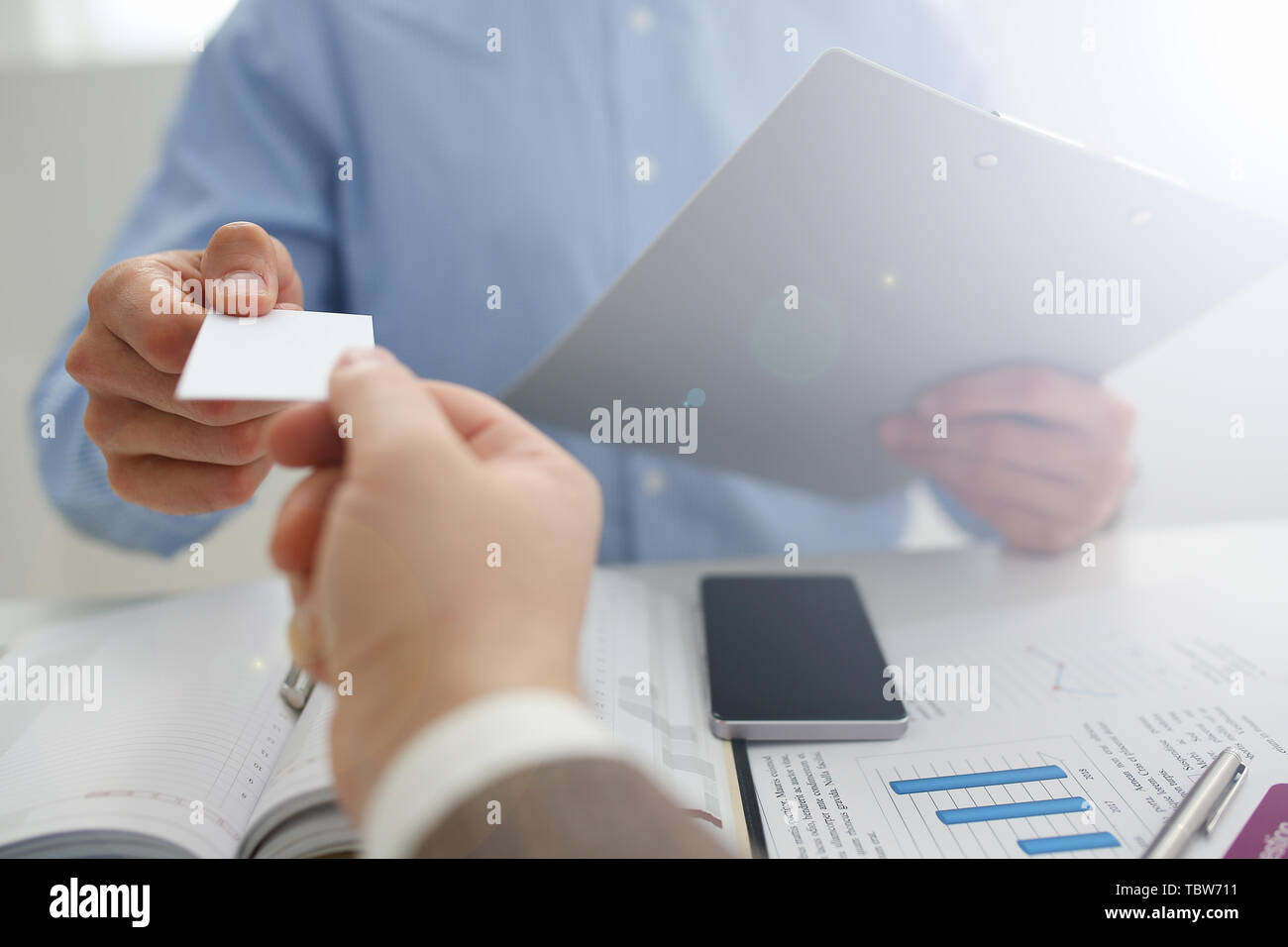 Male hand in suit give blank calling card Stock Photo - Alamy
