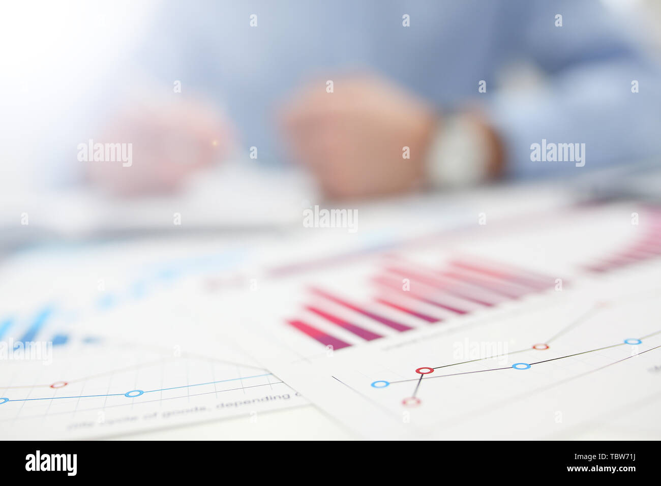 Group of people deliberate on problem with infographics closeup Stock ...