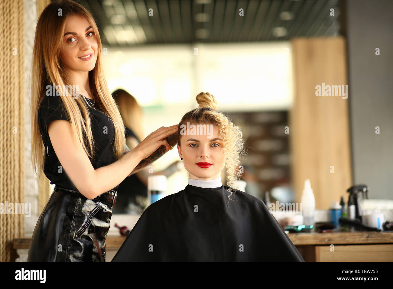 Woman Hairdresser and Client with Curly Hairstyle. Girl Client with ...