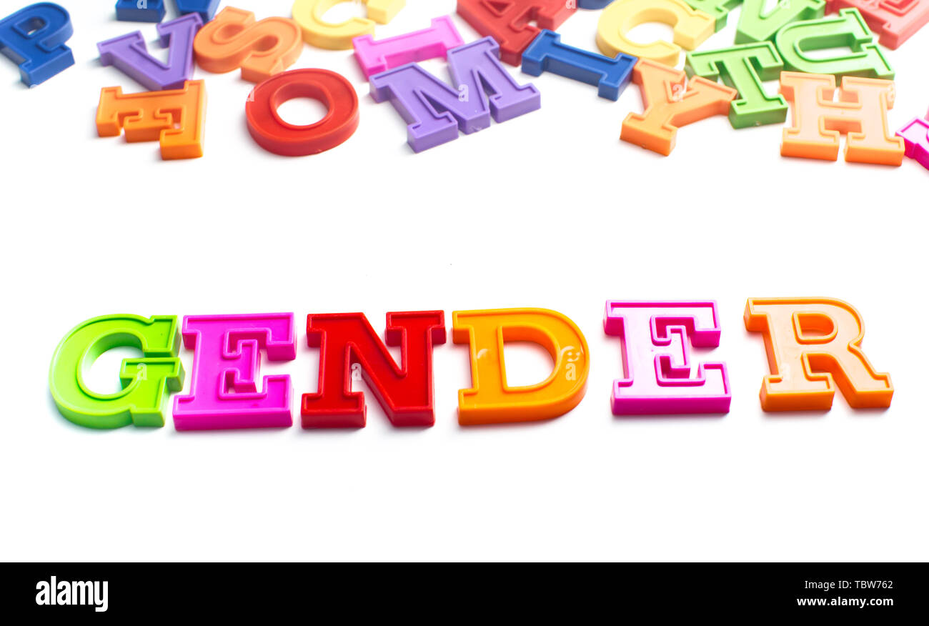 Heap of plastic colored alphabet letters close up. Gender Stock Photo ...