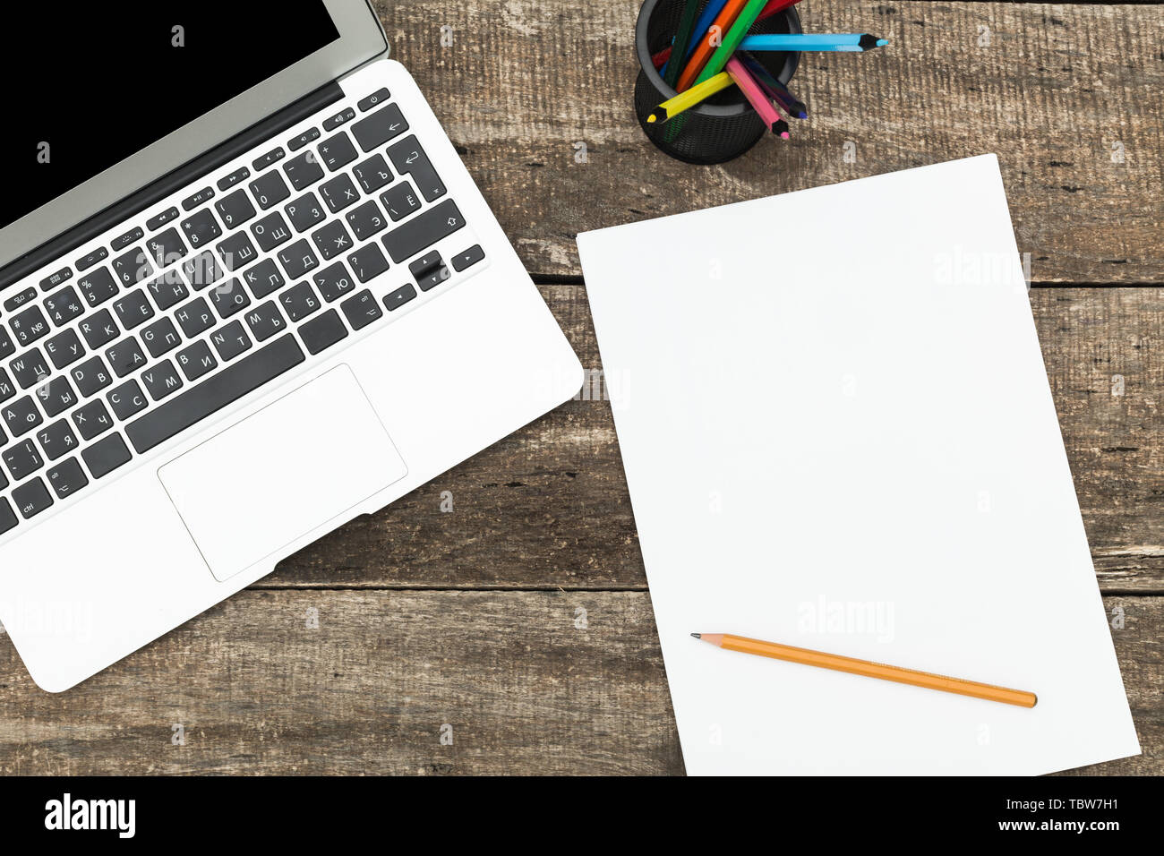 office stuff with notepad, laptop top view shot Stock Photo - Alamy