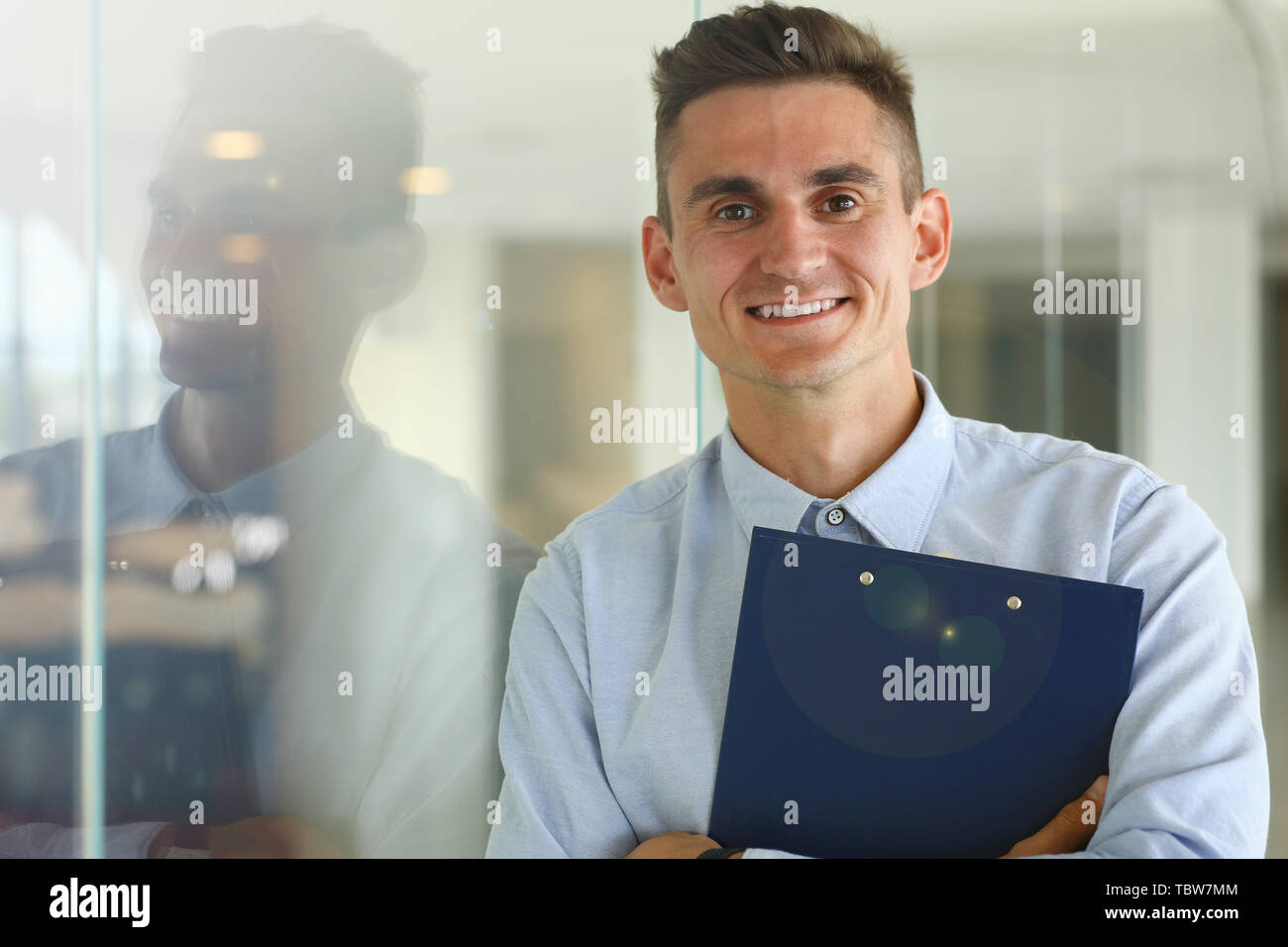 Corporate businessman smiling Stock Photo - Alamy