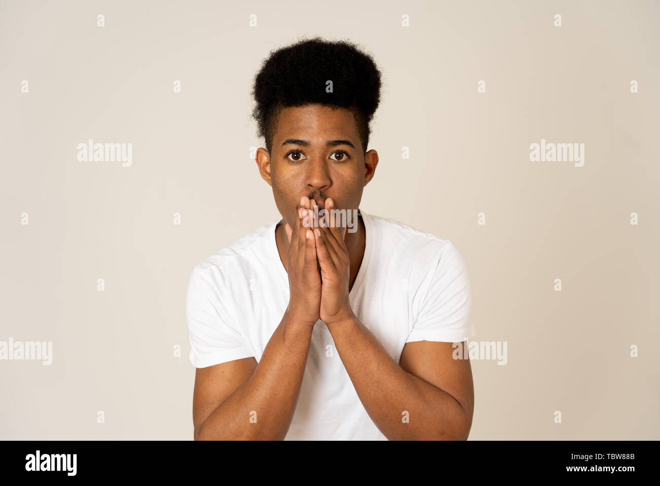Portrait of handsome shocked african american man hearing unexpected ...