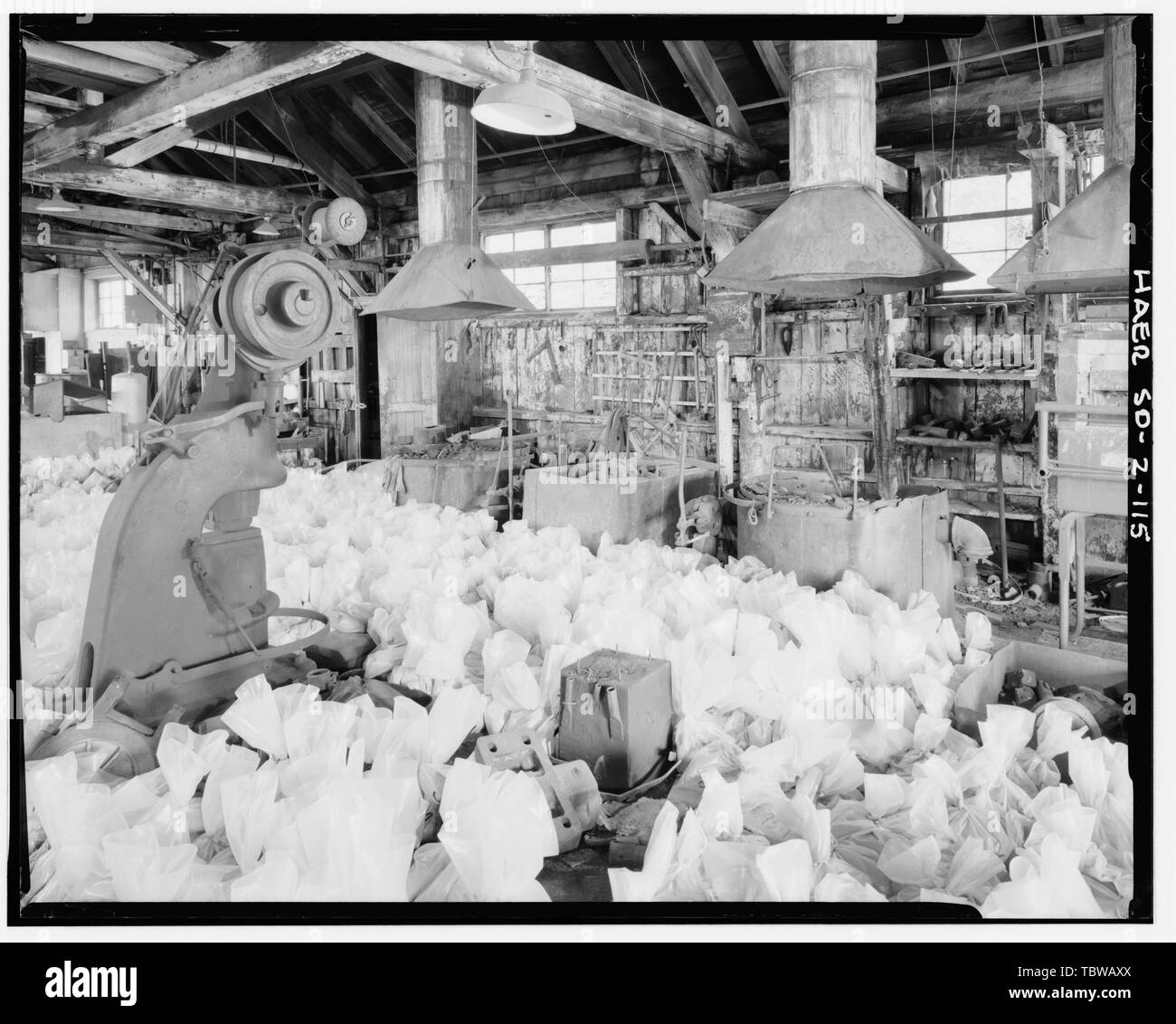 MACHINE SHOP FORGE AREA FROM NORTHWEST. POWER HAMMER IN FOREGROUND ON ...
