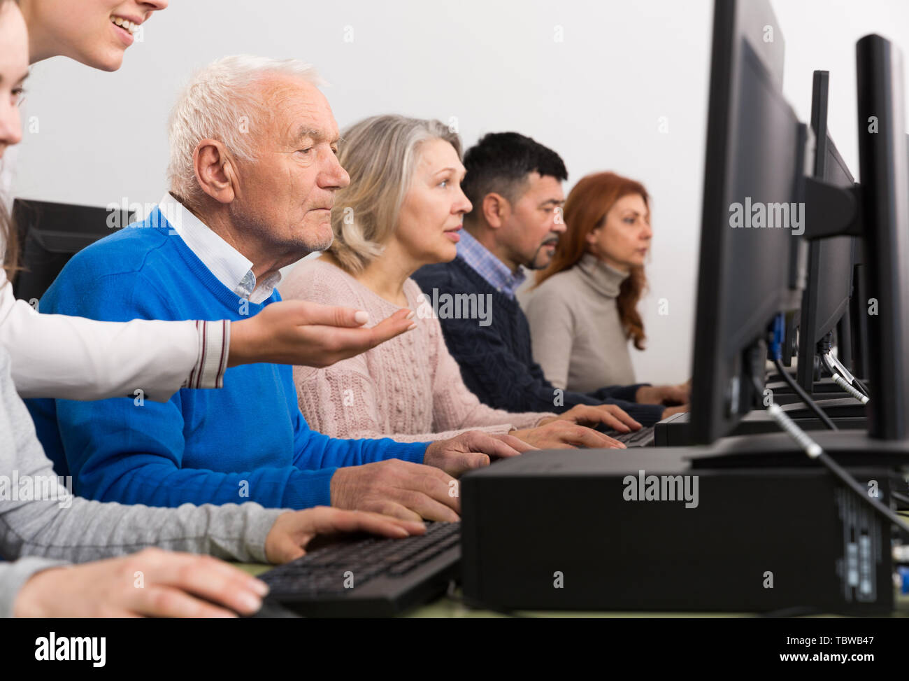 Portrait of focused senior man during computer classes for elderly ...
